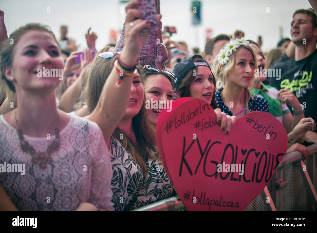 Enthusiastic and energetic music fans go crazy at a concert with the ...