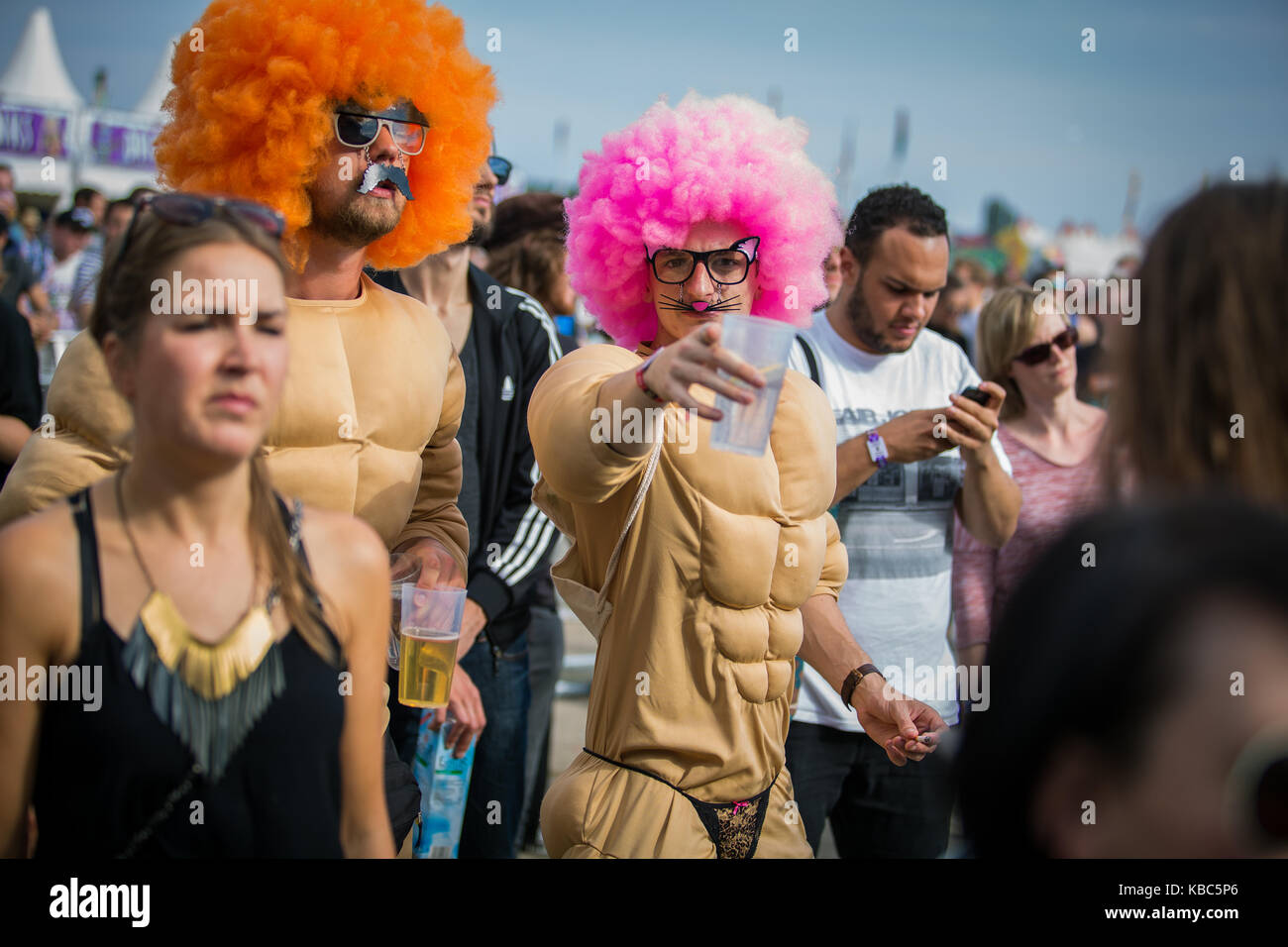 Enthusiastic and energetic music fans attend a concert with the ...