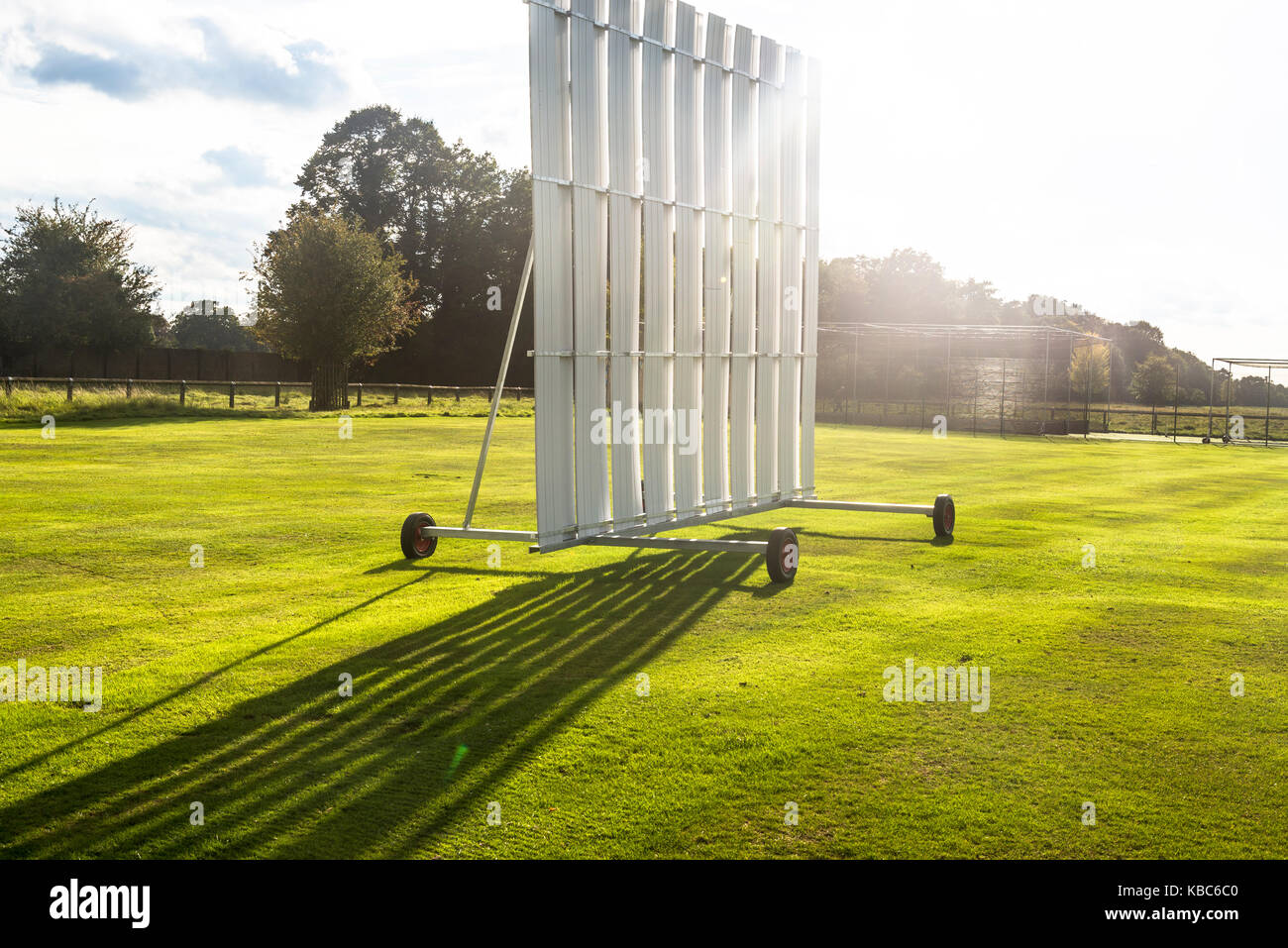 Cricket Sight screen casting long shadow Stock Photo - Alamy