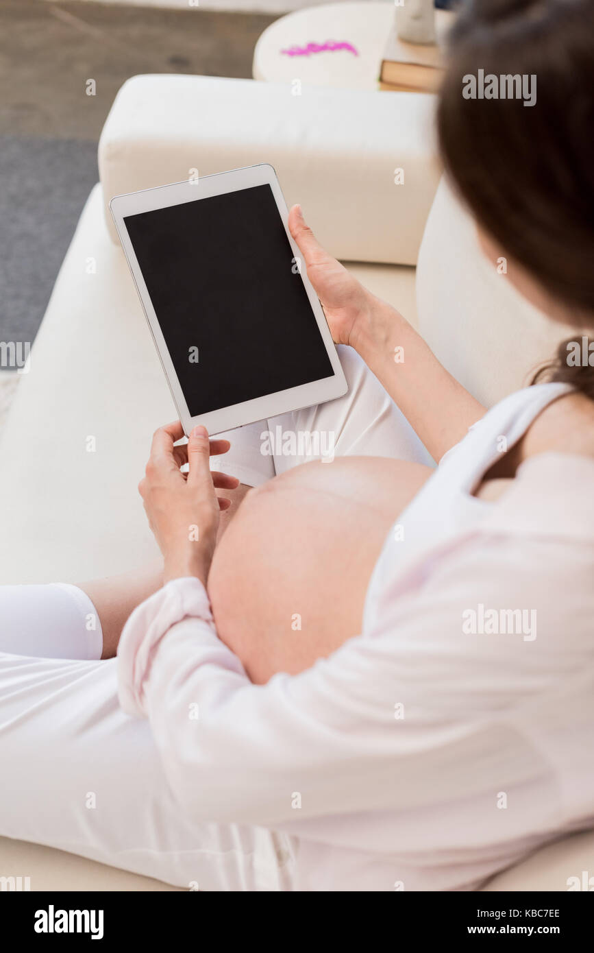 Pregnant woman with digital tablet Stock Photo - Alamy