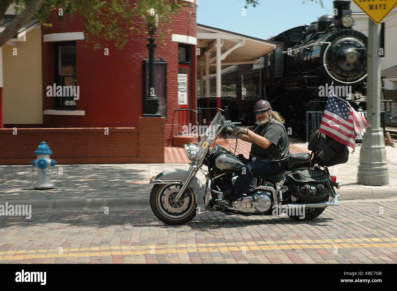 Happy motorcyclist riding a Harley in Orlando, Florida Stock Photo - Alamy
