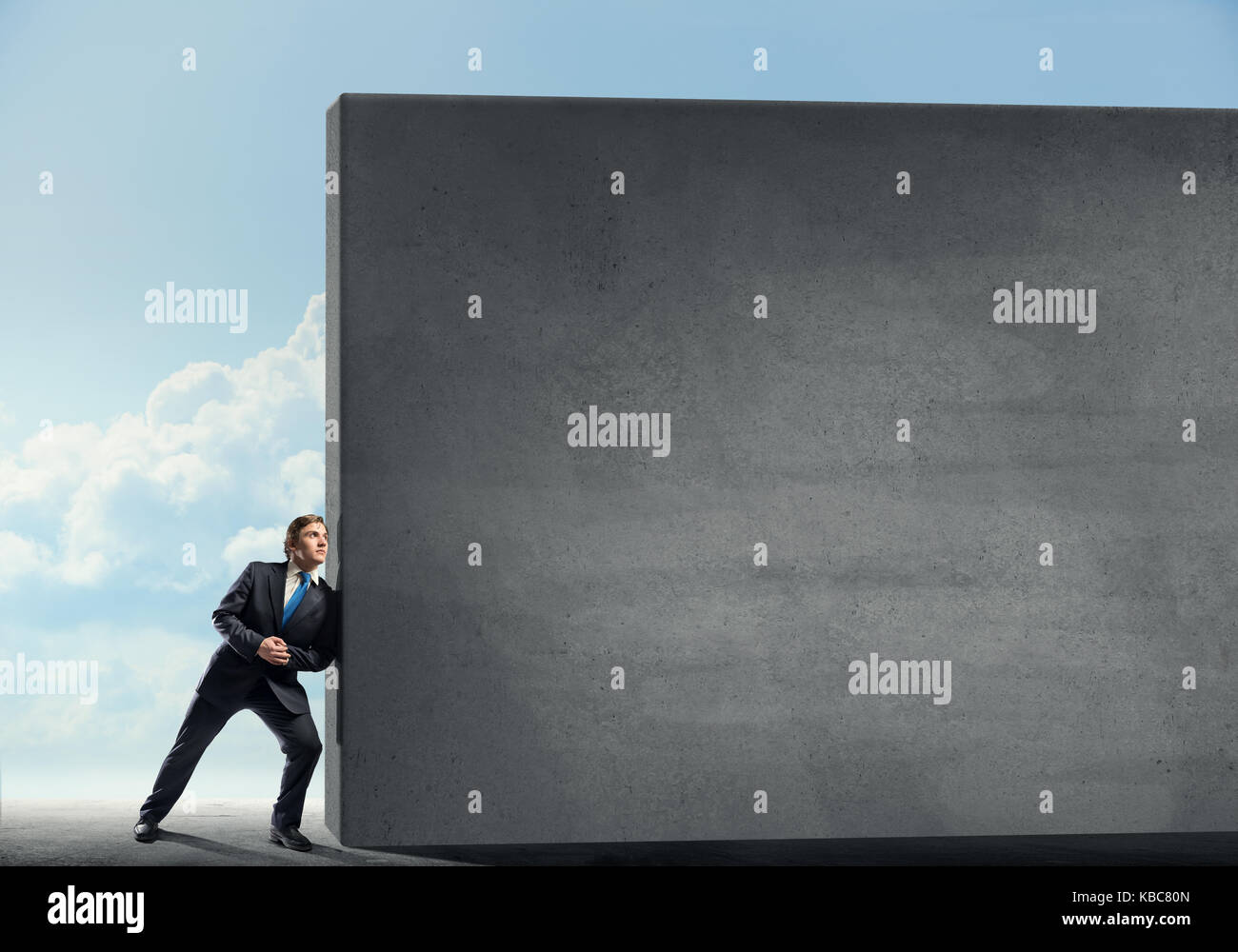 Businessman push wall Stock Photo - Alamy