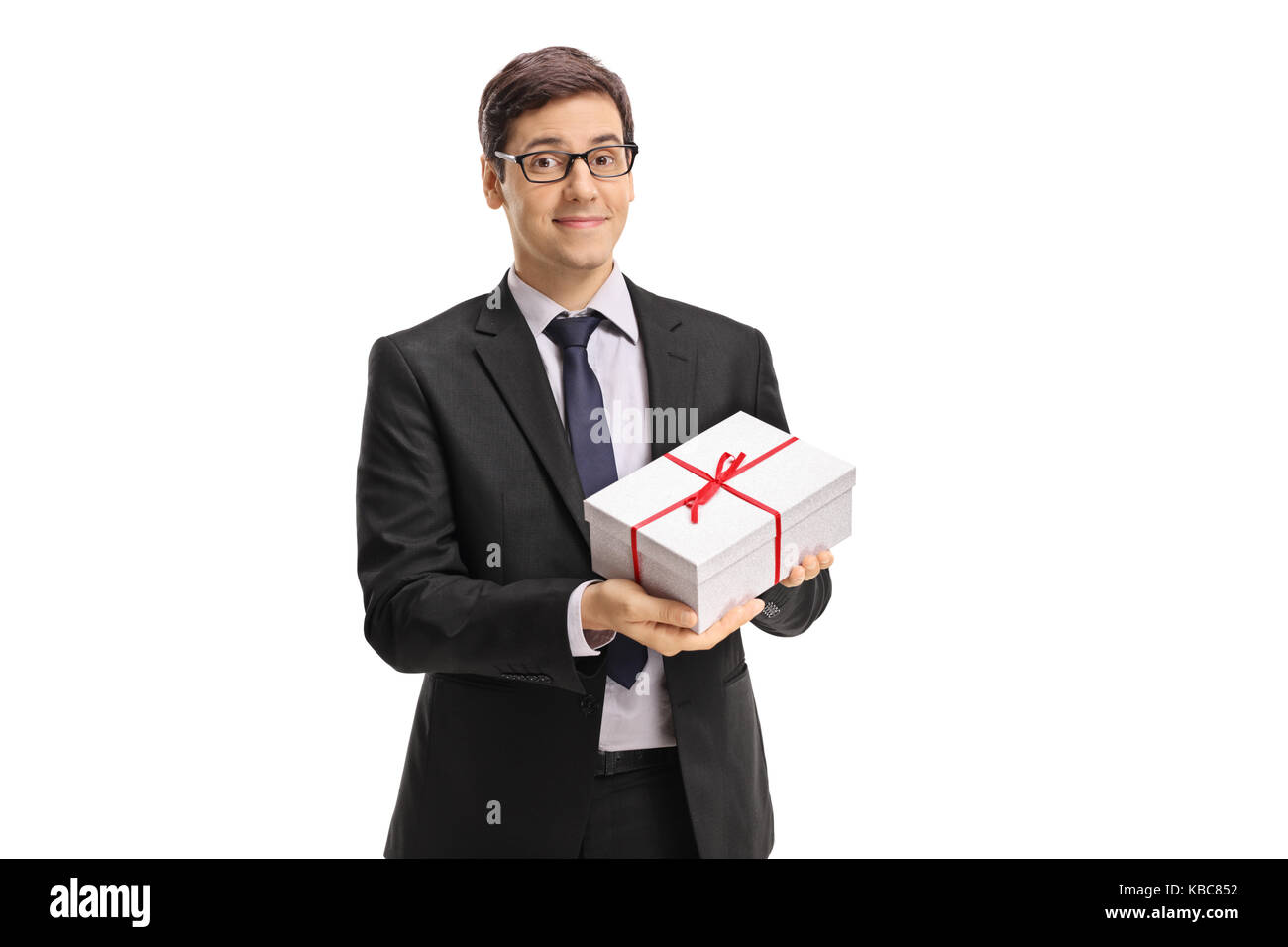 Businessman holding a present isolated on white background Stock Photo ...