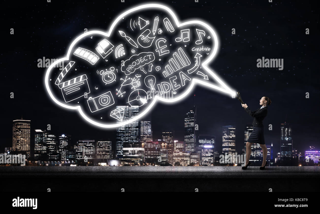 Woman throwing light on her ideas Stock Photo - Alamy