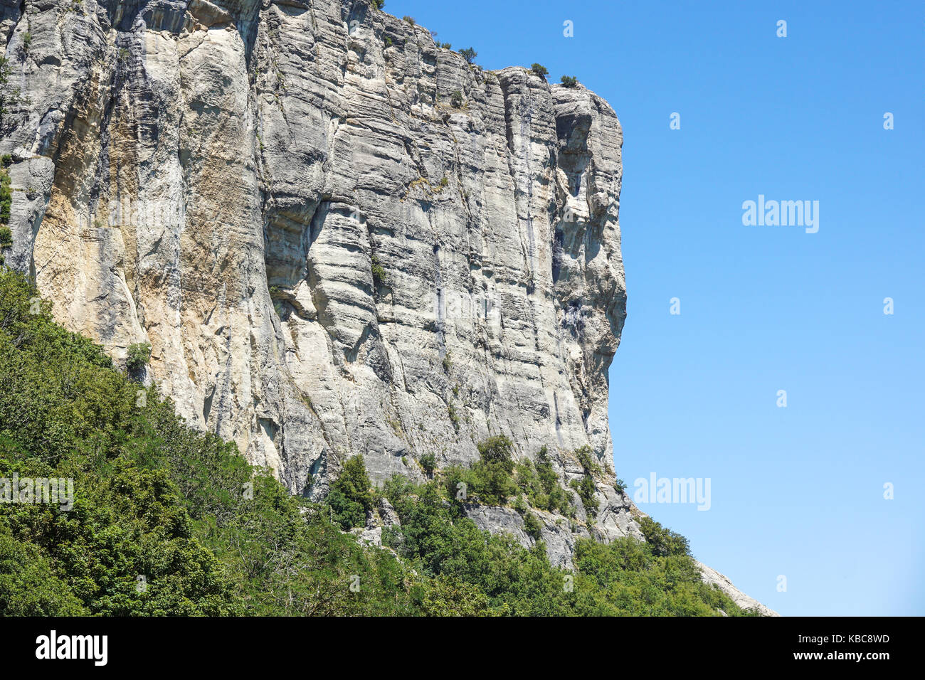 vertical mountain . Rock climbing the steep cliffs of the mountains ...