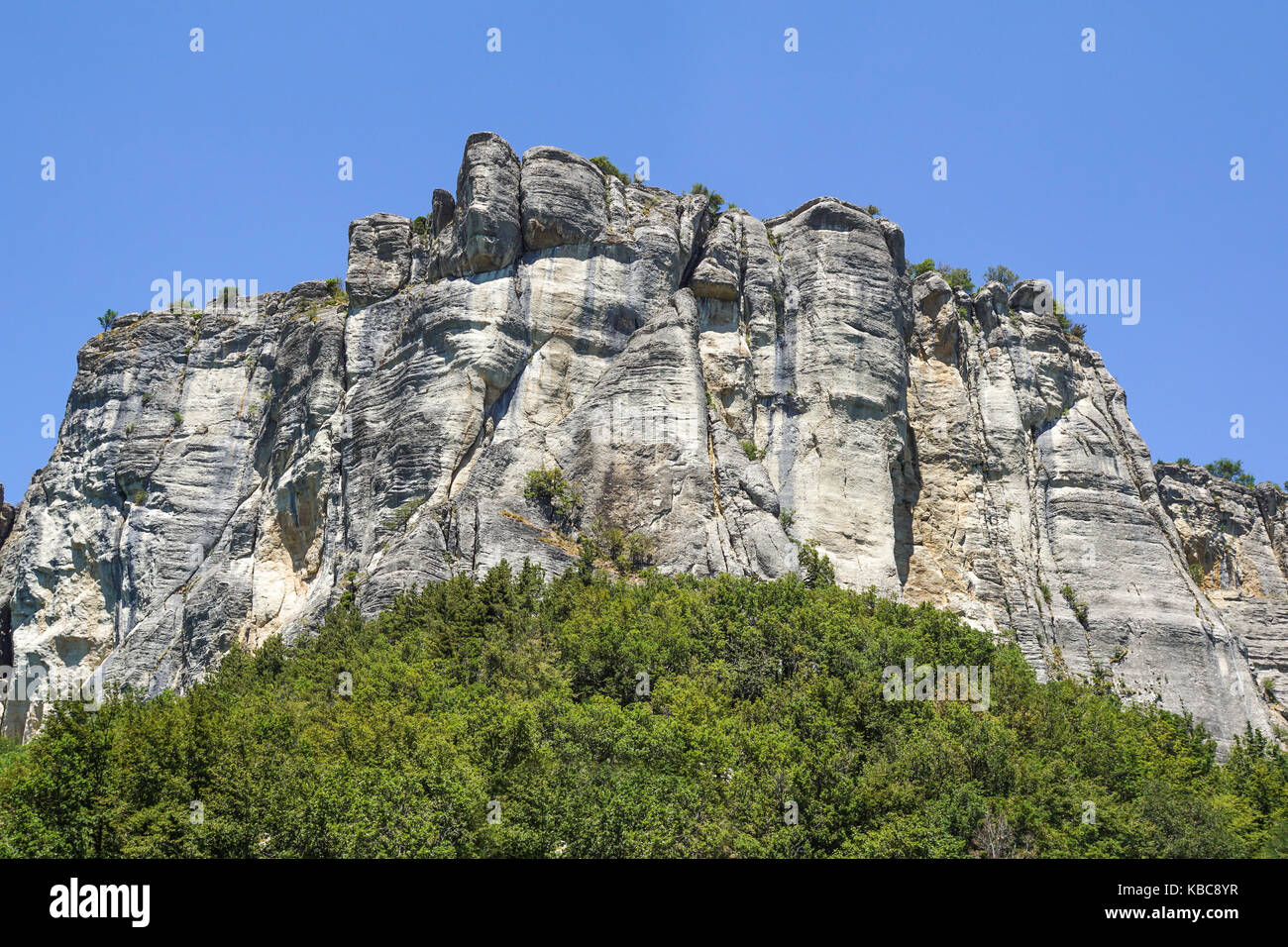 Giant sharp stones among the grass on the top of mountain meadows in ...
