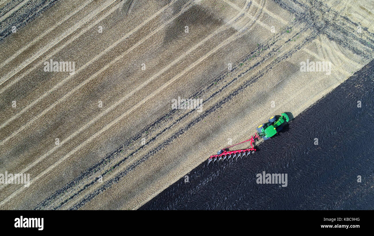 John Deere tractor ploughing wheat stubble Stock Photo - Alamy