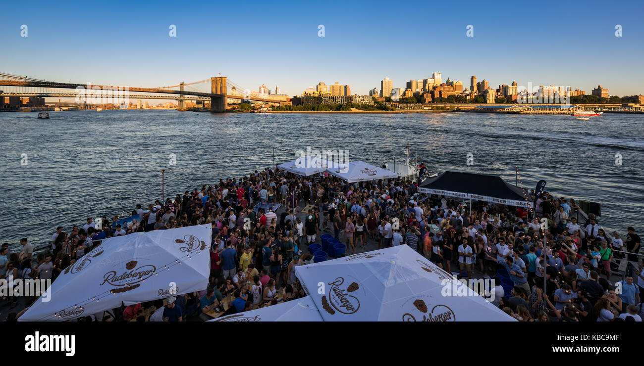 Summer party at sunset on Pier 15 in Lower Manhattan with view of ...