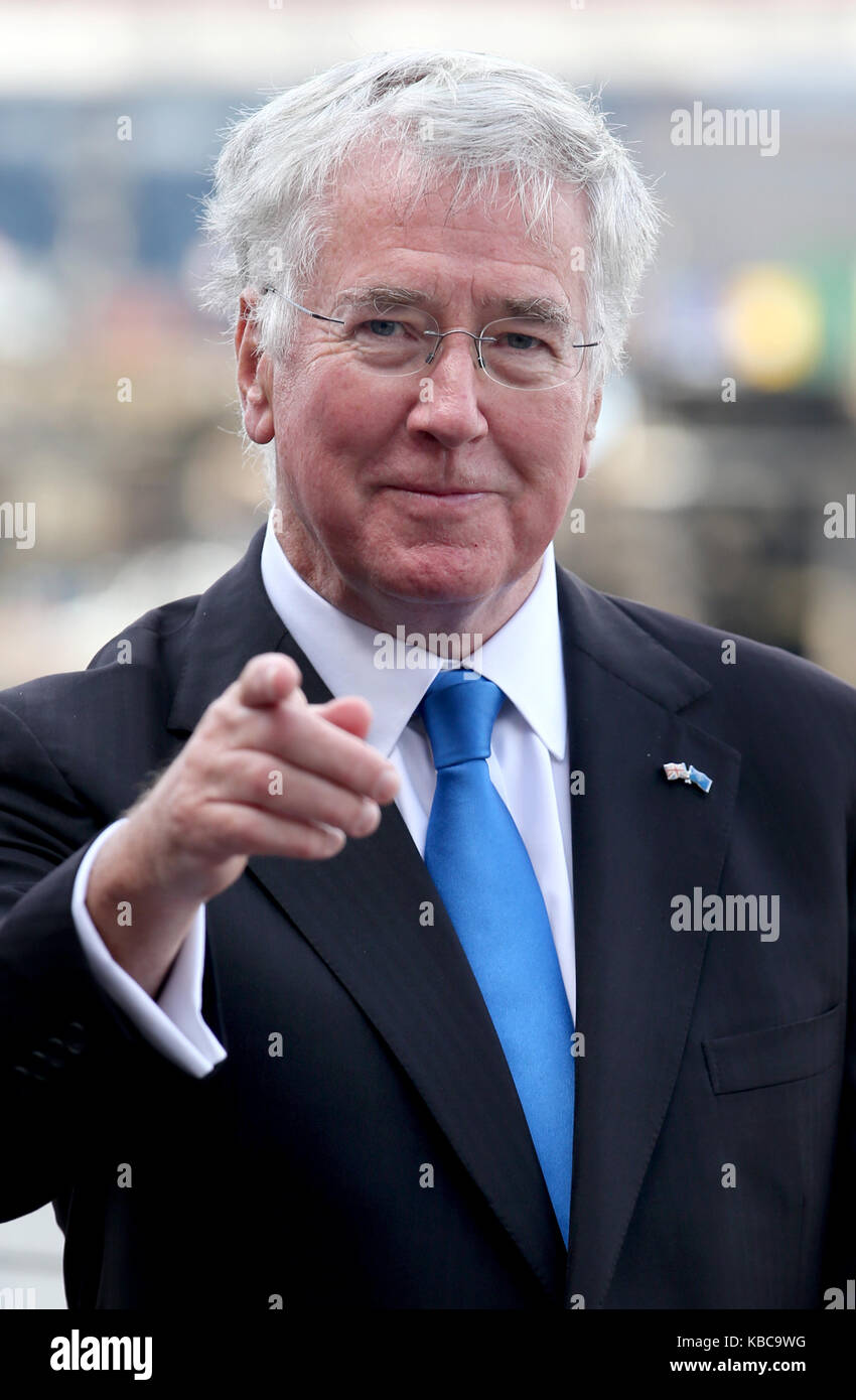 Defence Secretary Sir Michael Fallon speaks to the media alongside the ...