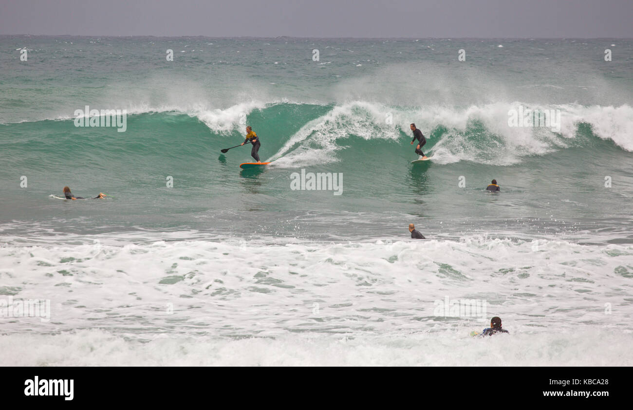Surfer paddling out into the waves hi-res stock photography and images ...