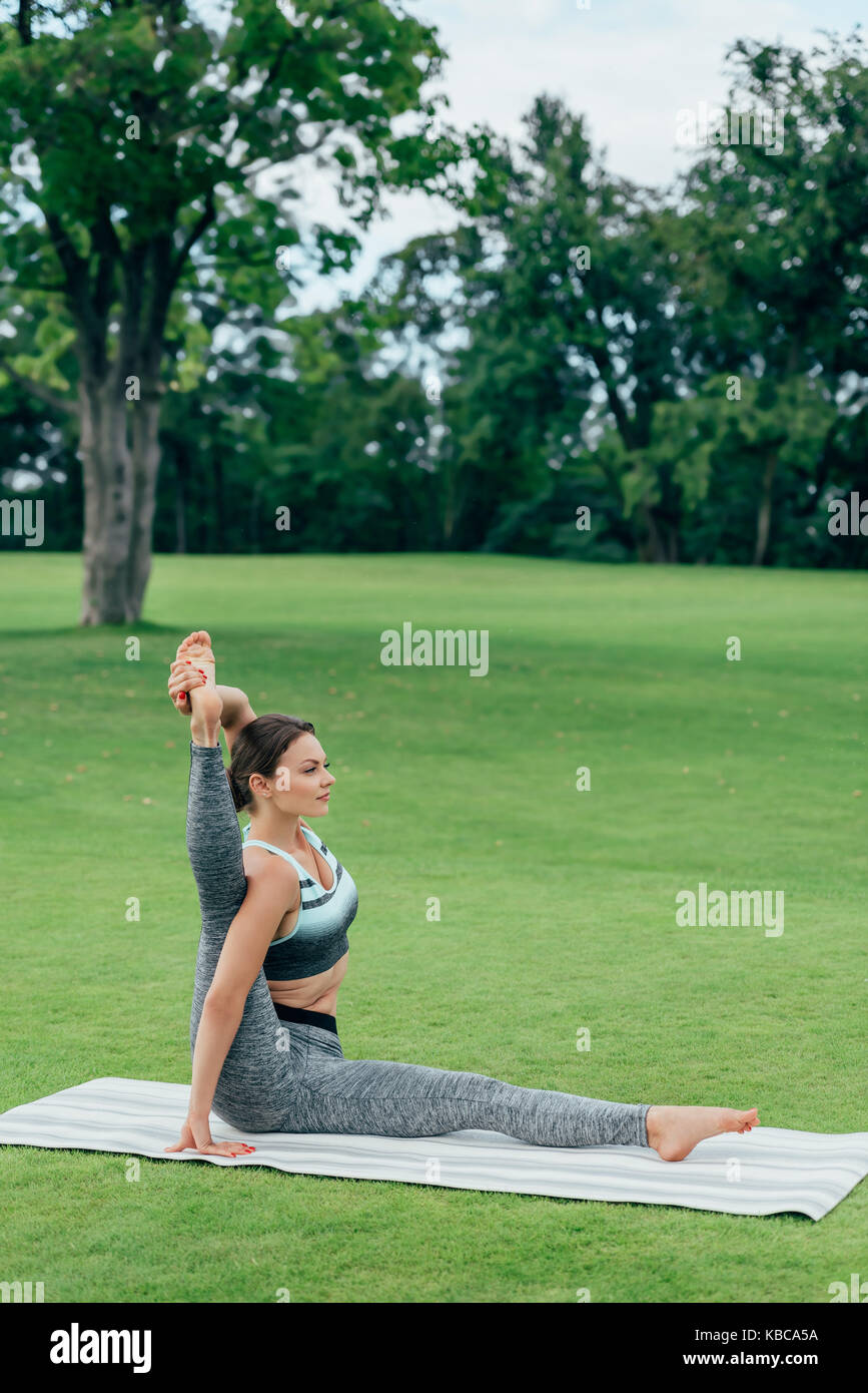 Woman performing seated exercise hi-res stock photography and images ...