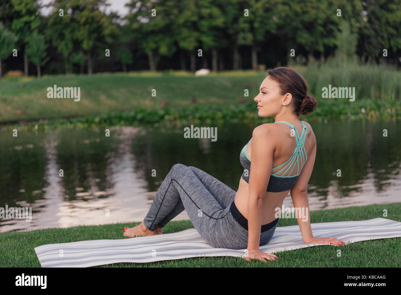 woman resting at lake Stock Photo - Alamy