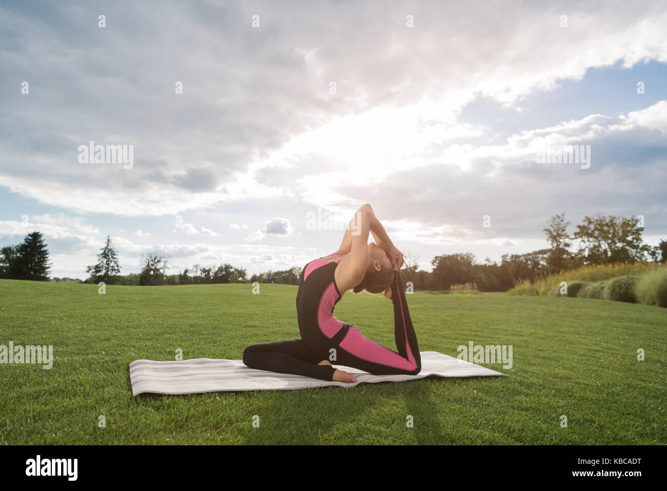 woman sitting in yoga position Stock Photo - Alamy