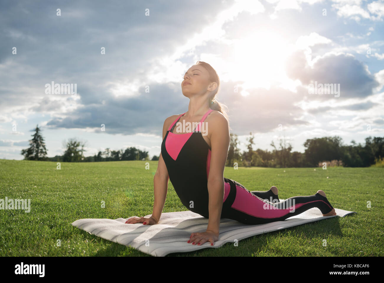 relaxed woman practicing yoga pose Stock Photo - Alamy