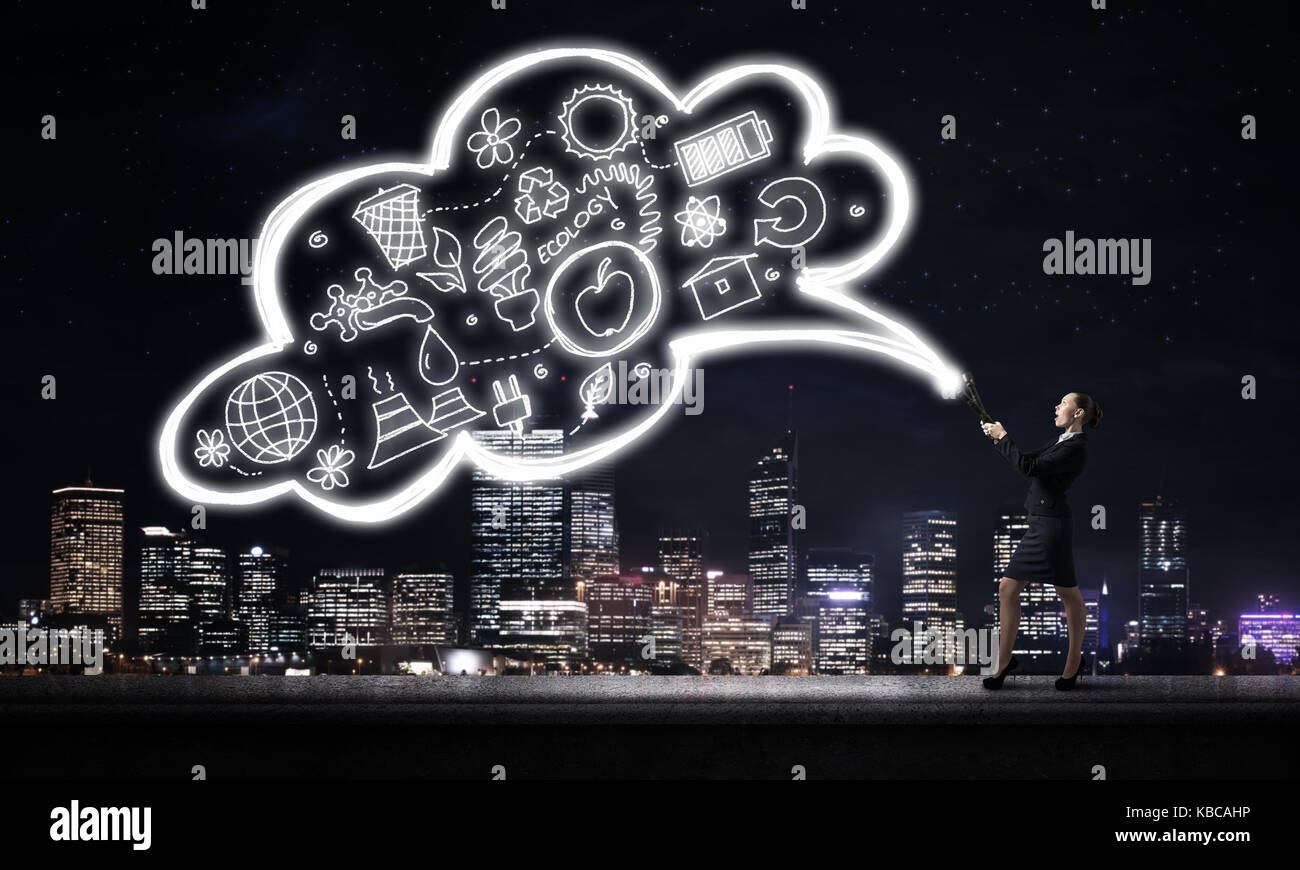 Woman throwing light on her ideas Stock Photo - Alamy