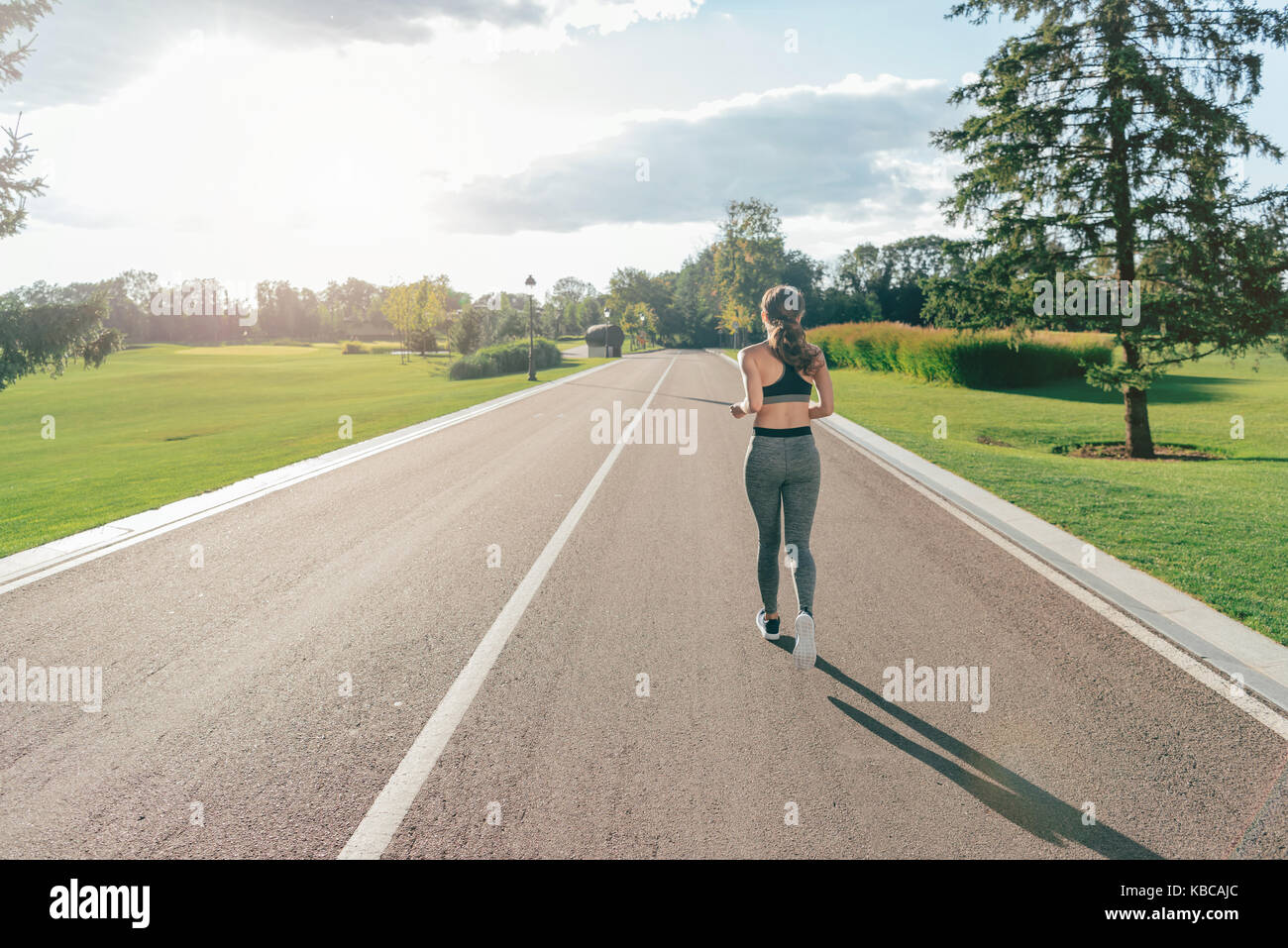 woman running in park Stock Photo - Alamy