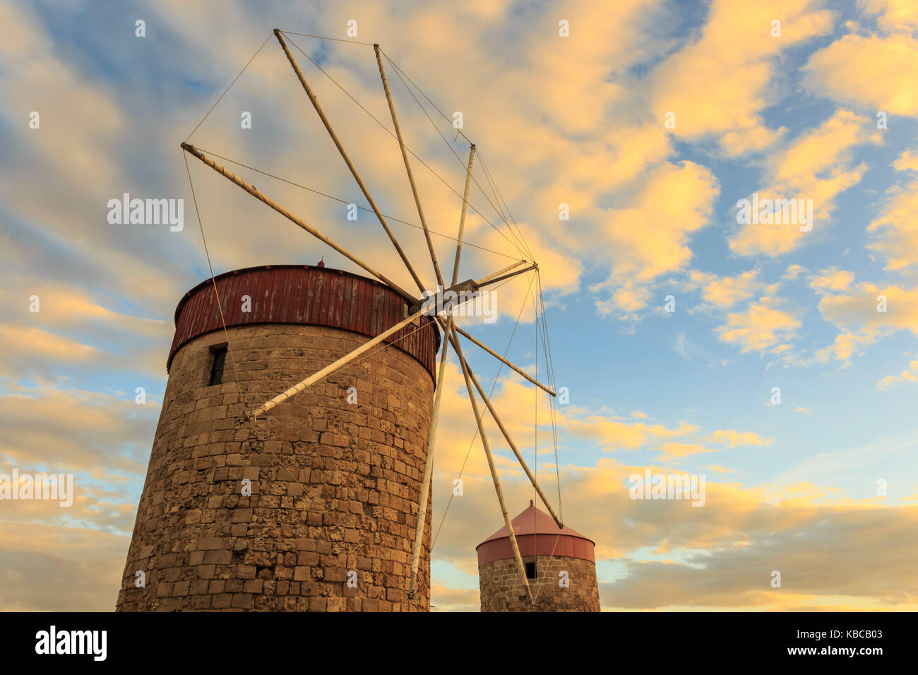 Mandraki Harbour medieval windmills at sunset, Rhodes, Dodecanese ...