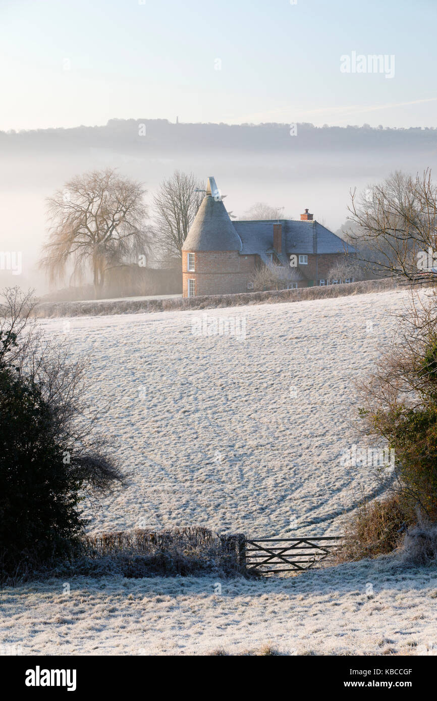 Old oast house in winter frost, Burwash, East Sussex, England, United ...