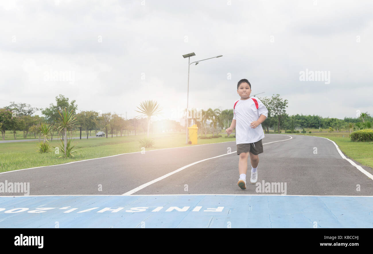 Obese fat boy running to the finished line., exercise to lose weight ...