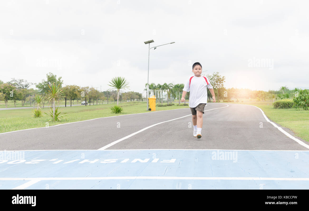 Obese fat boy walking to the finished line., exercise to lose weight ...