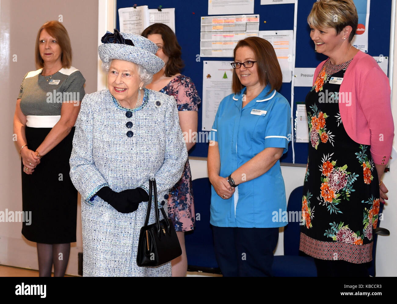 Queen elizabeth ii meets staff during hi-res stock photography and ...