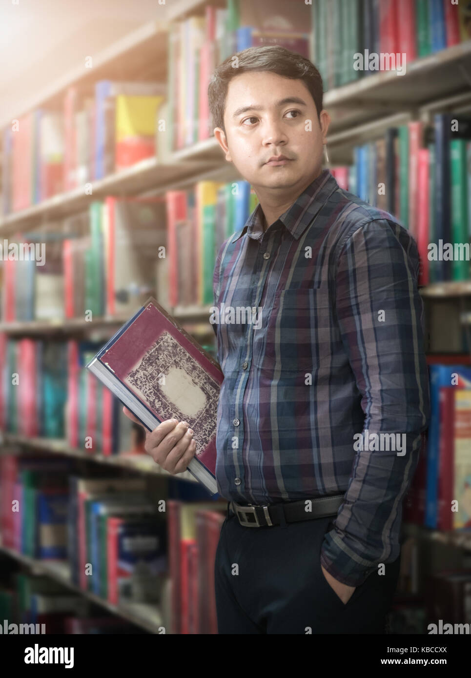 Teacher holding book hi-res stock photography and images - Alamy