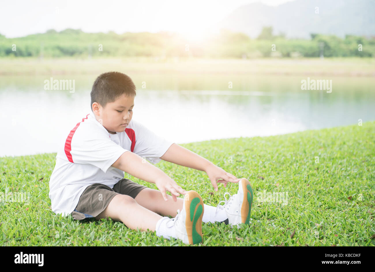obese fat boy exercise to lose weight. healthy concept Stock Photo - Alamy