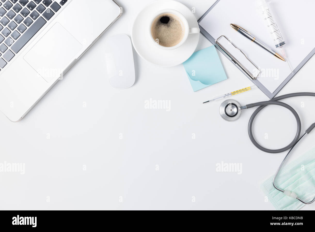 Top view of doctor desk table with stethoscope, coffee and blank paper ...