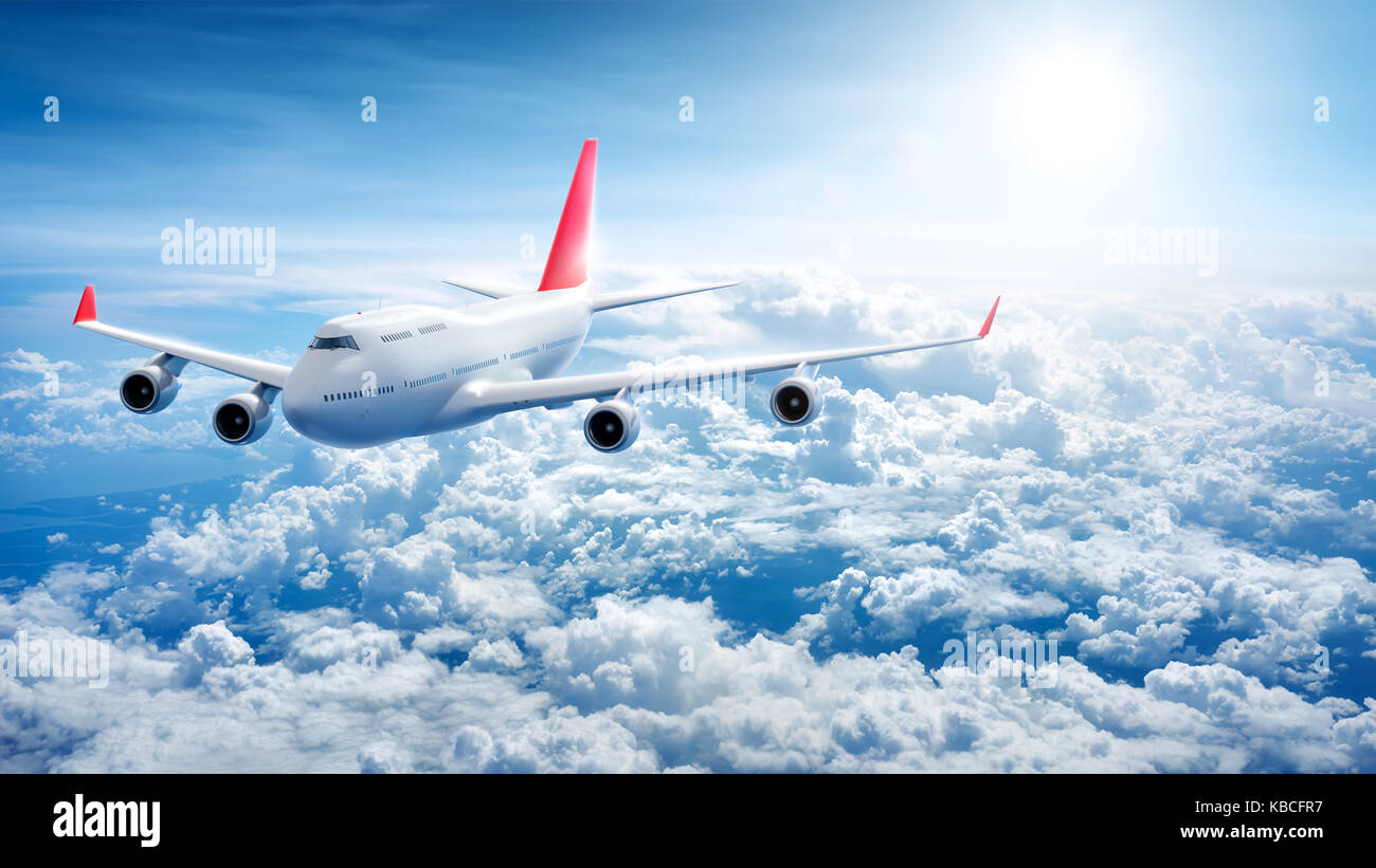 Airplane flying above clouds Stock Photo - Alamy