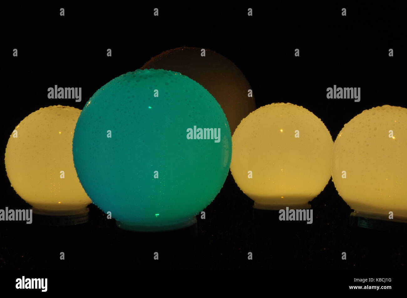 Lanterns lit in the garden. Night and the glowing balls Stock Photo - Alamy