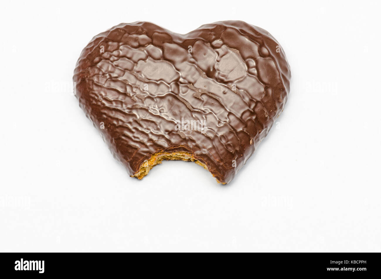 bitten-into chocolate heart on white background Stock Photo - Alamy