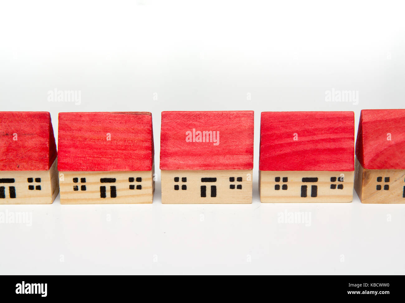row of model houses on a white background Stock Photo - Alamy
