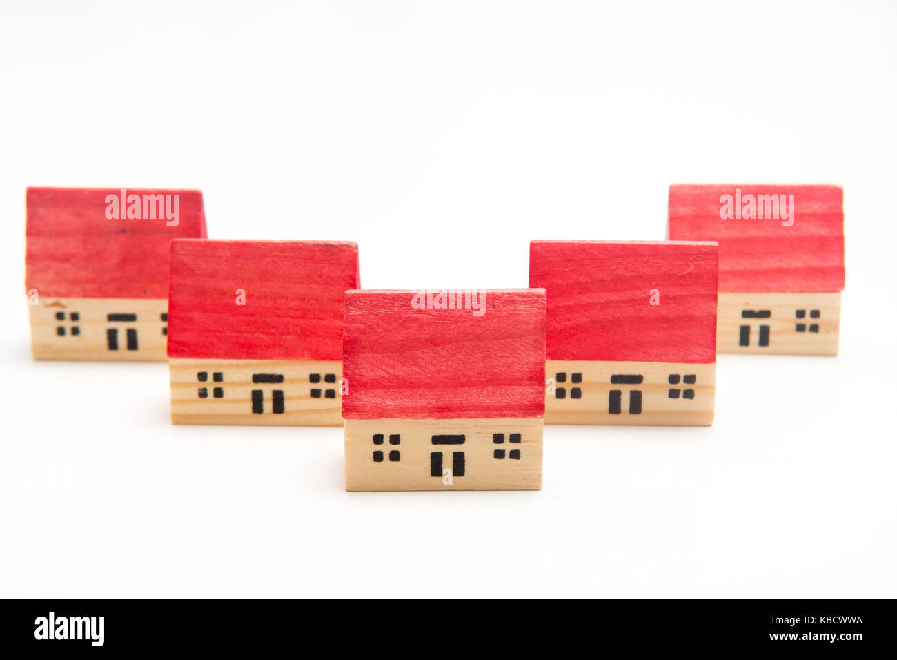Model homes arranged on isolated white background for construction ...
