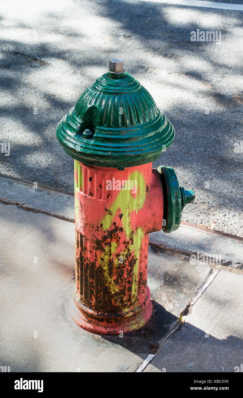 Cheerful colors painted on an old fire hydrant Stock Photo - Alamy
