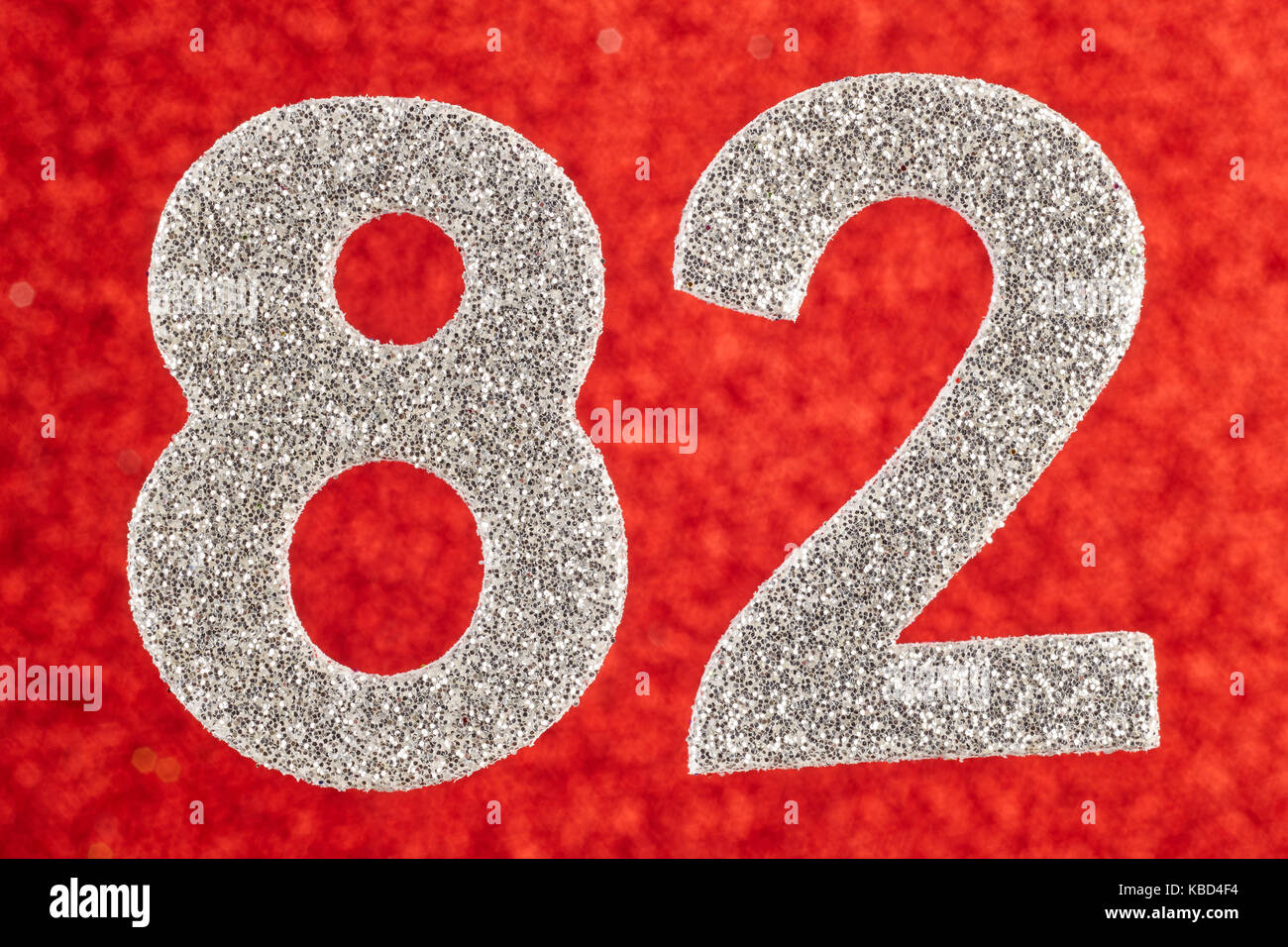 Number eighty-two silver color over a red background. Anniversary ...