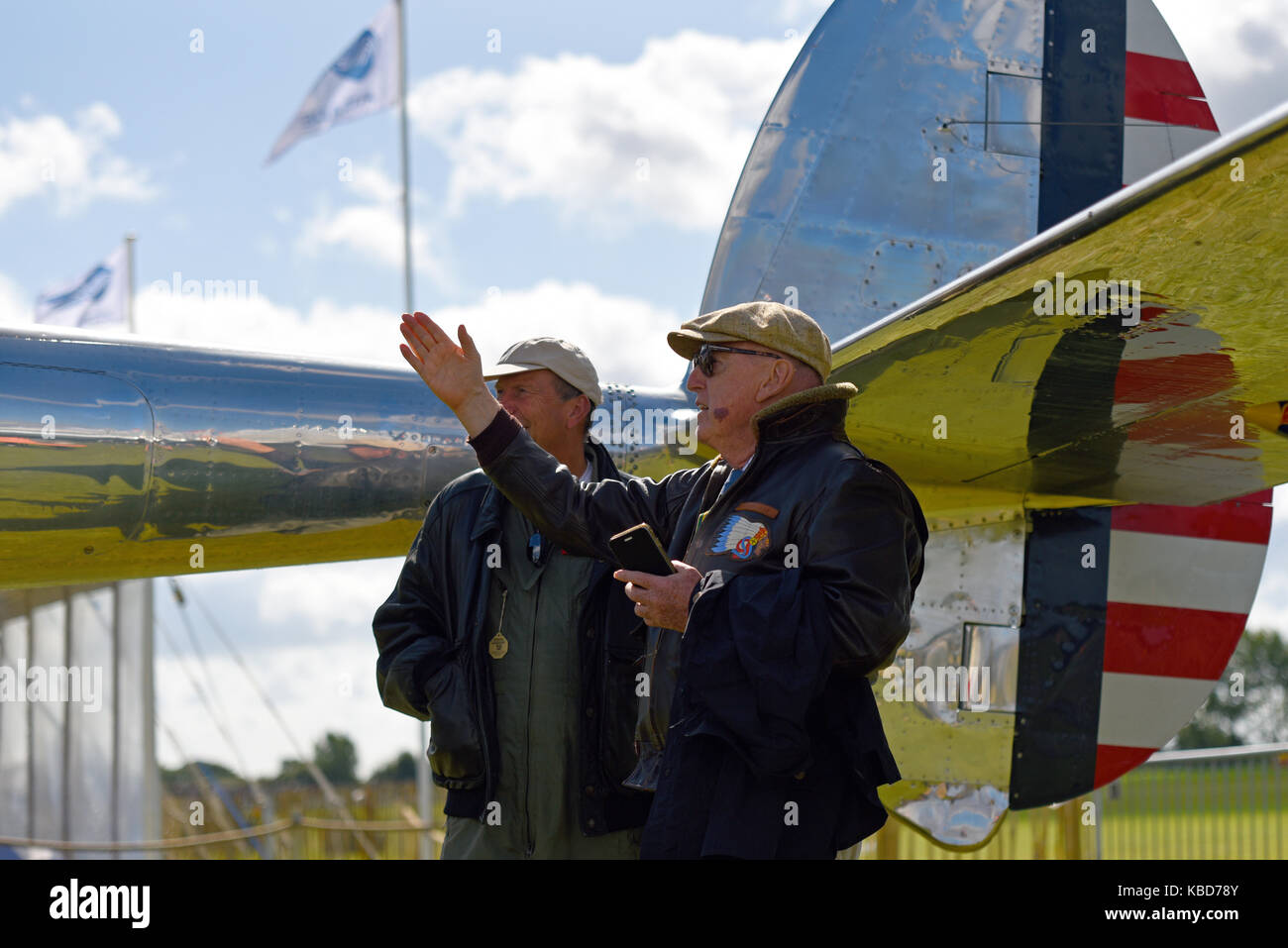 Pilot and warbird owner Stephen Grey making a flying plane hand motion ...