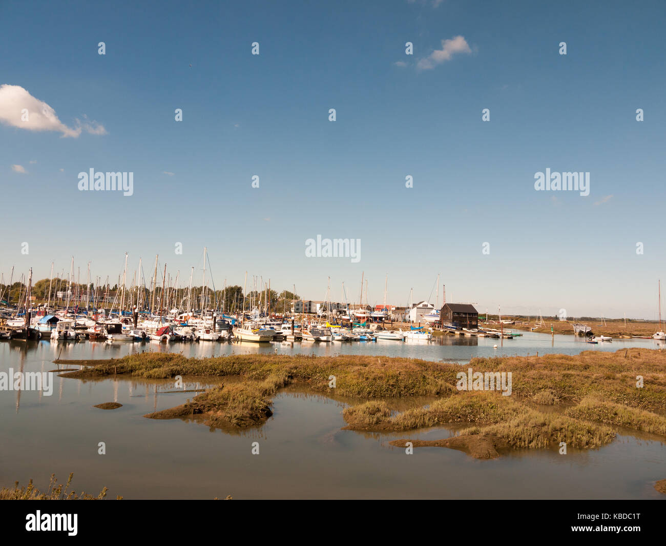landscape view scene of boats moored in dock marina harbour; essex ...