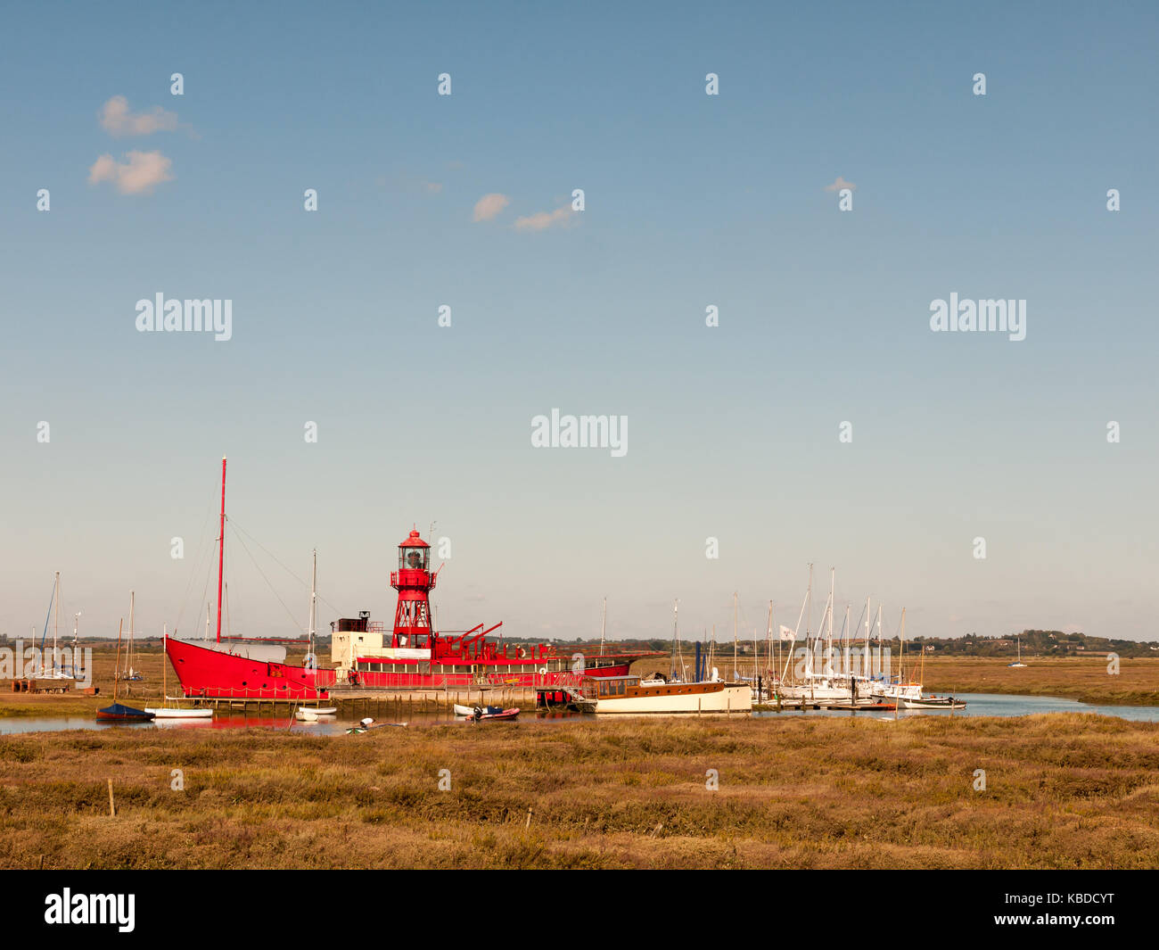 red life boat moored in tollesbury maldon estuary blue sky; essex ...