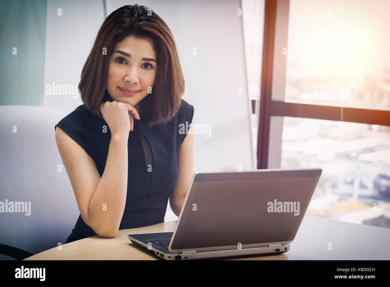 Business woman working laptop in office Stock Photo - Alamy