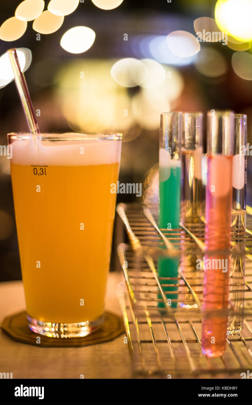 beer cocktail with fruits syrup in test tube Stock Photo - Alamy