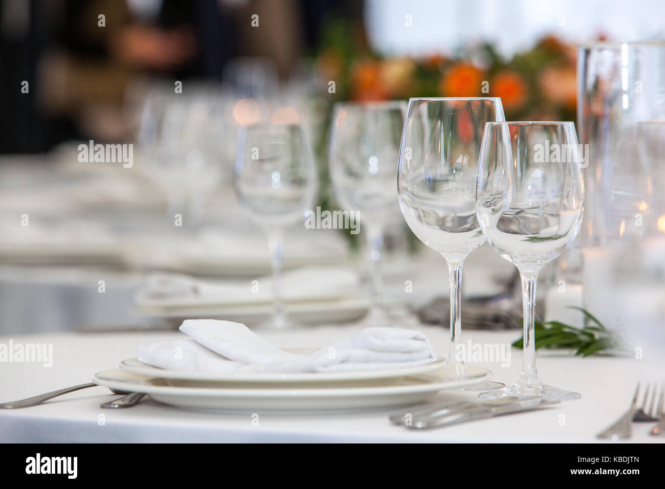 Table setting with glasses for different drinks on table on room ...