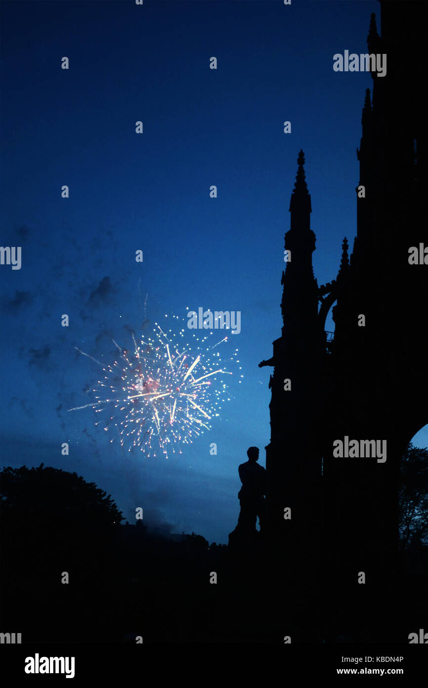 Scott Monument, Edinburgh, Scotland, at dusk, with fireworks overhead ...