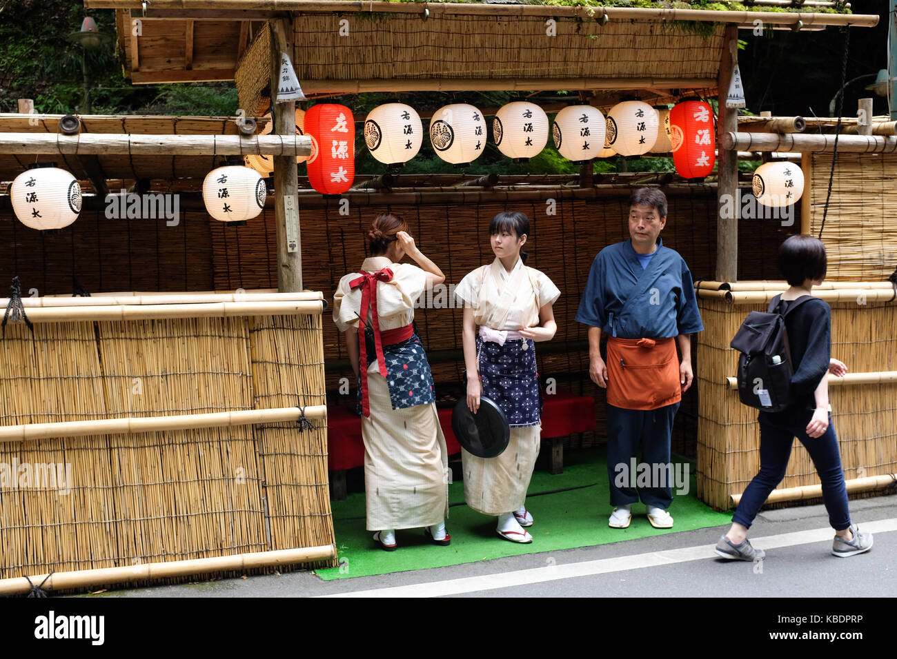 Staff waiting outside a restaurant in the village of Kibune just north ...