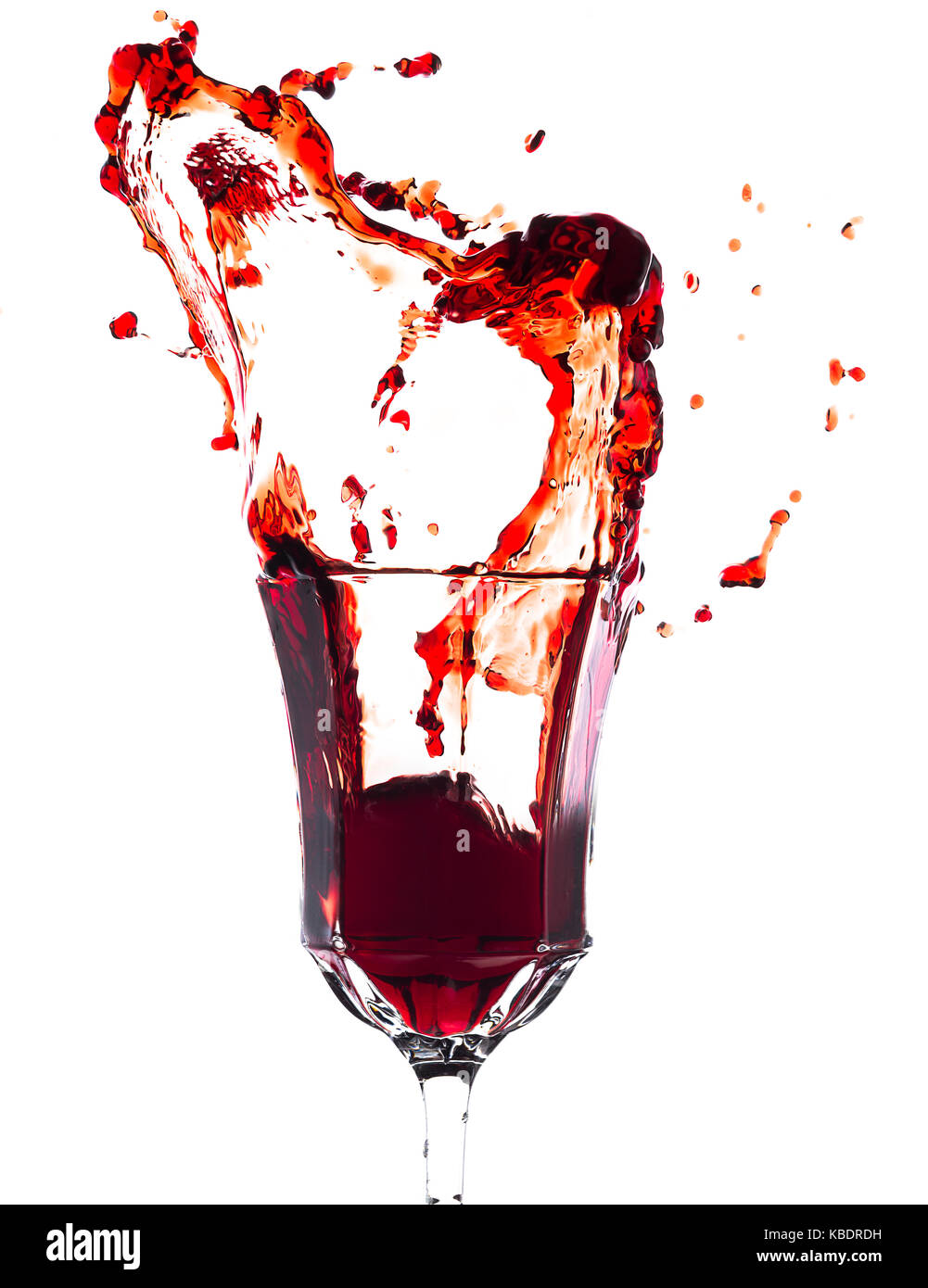 Glass of splash red wine Stock Photo - Alamy