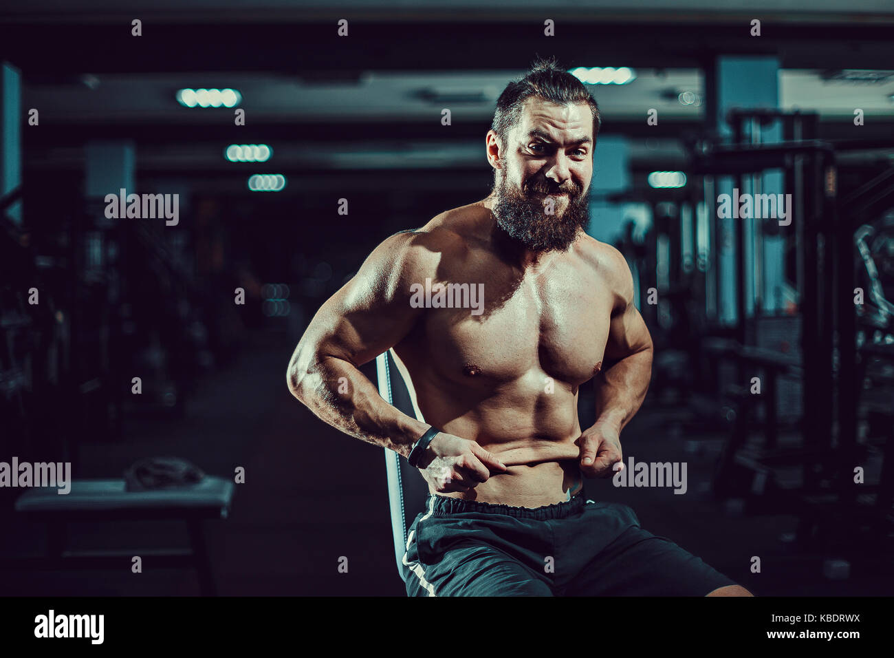 Bodybuilder pulling skin Stock Photo - Alamy