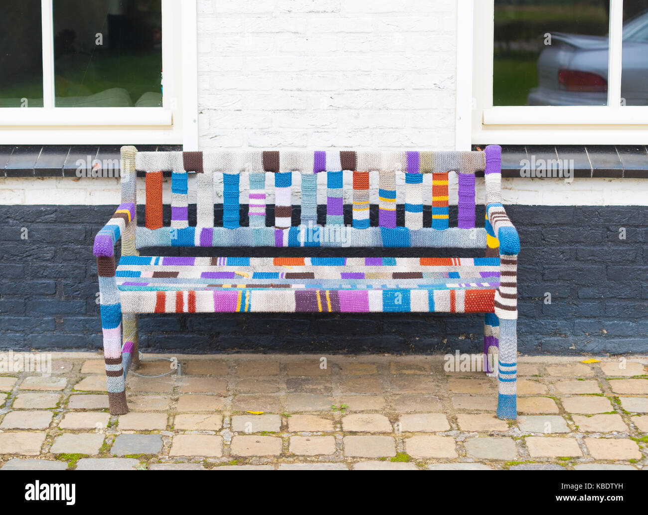 colorful decorated outdoor bench in front of a house Stock Photo - Alamy