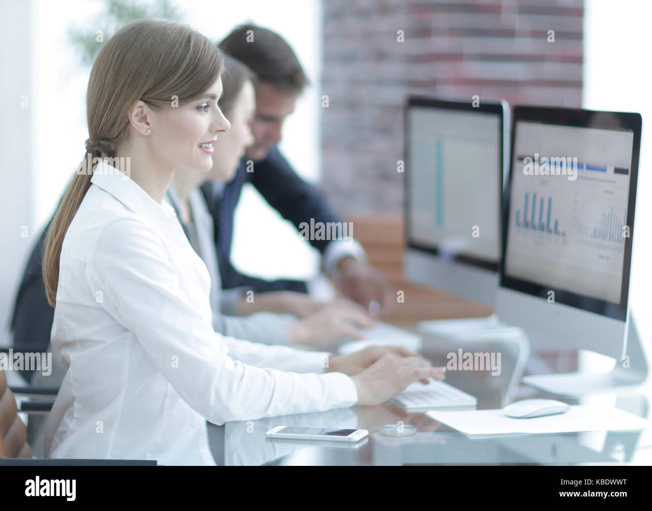 business team working on computers with financial data. the concept of ...