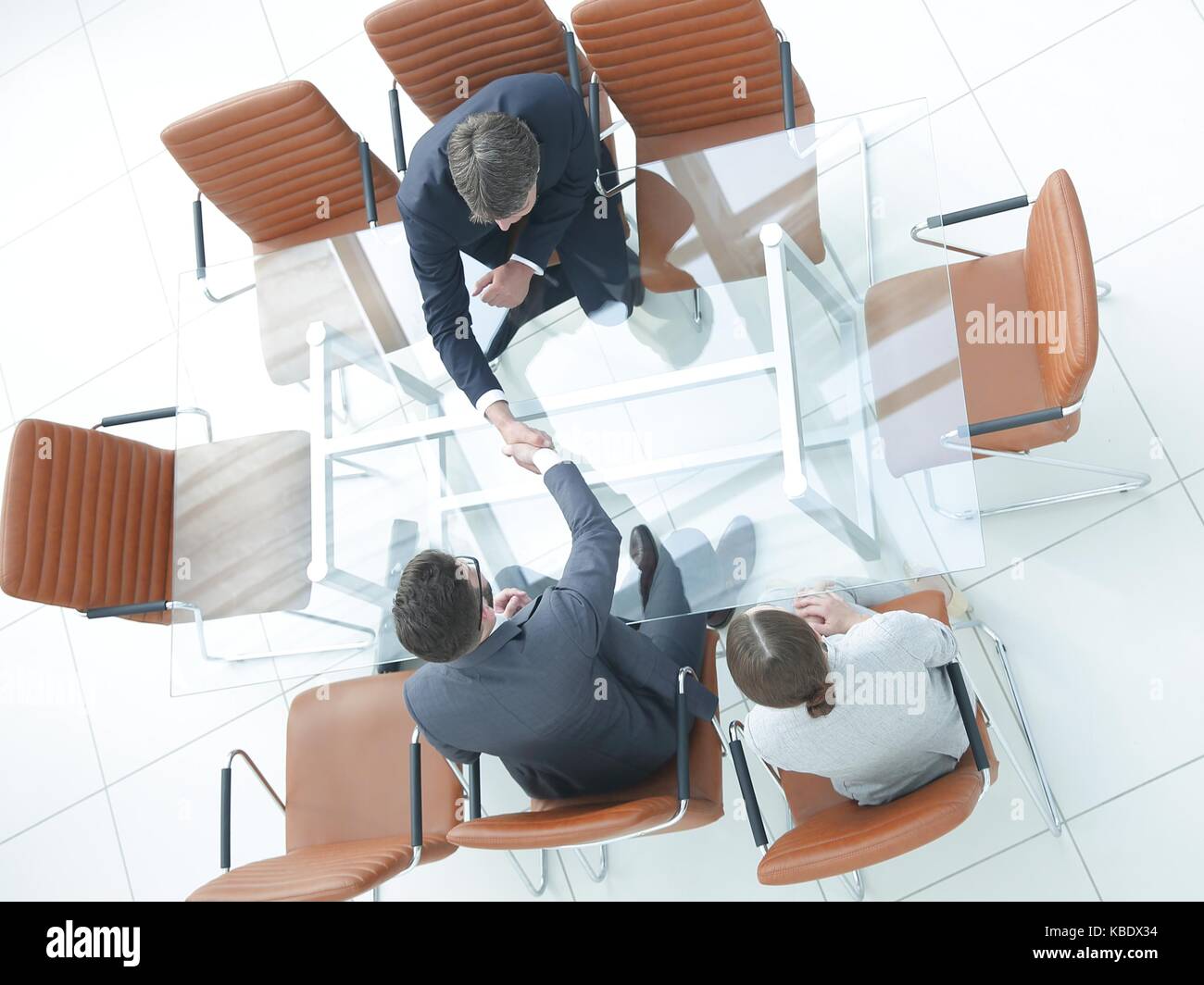 Top view Handshake across the table. Meeting in the conference room ...