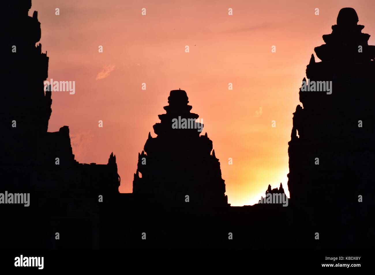 Sunrise behind mysterious towers of ancient Angkor Wat Buddhist temple ...