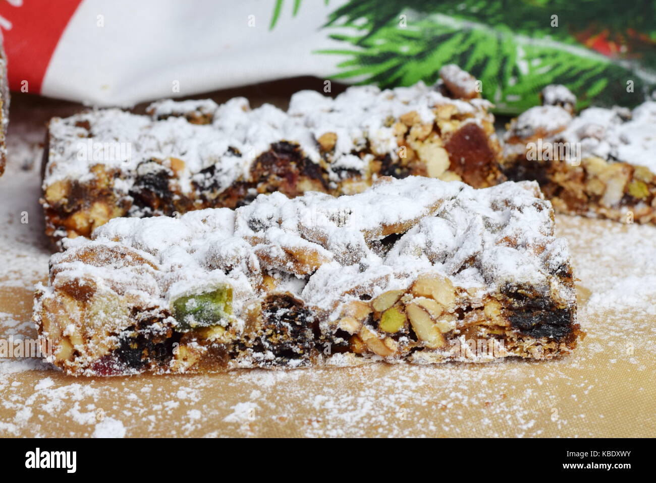 Italian Christmas dessert with nuts and candied fruits in a sugar ...